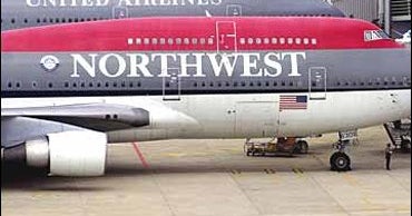 Plane Gets Military Escort - CBS News