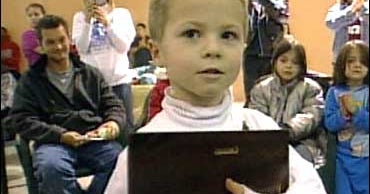 Tot Collects Toys For Katrina Kids - CBS News