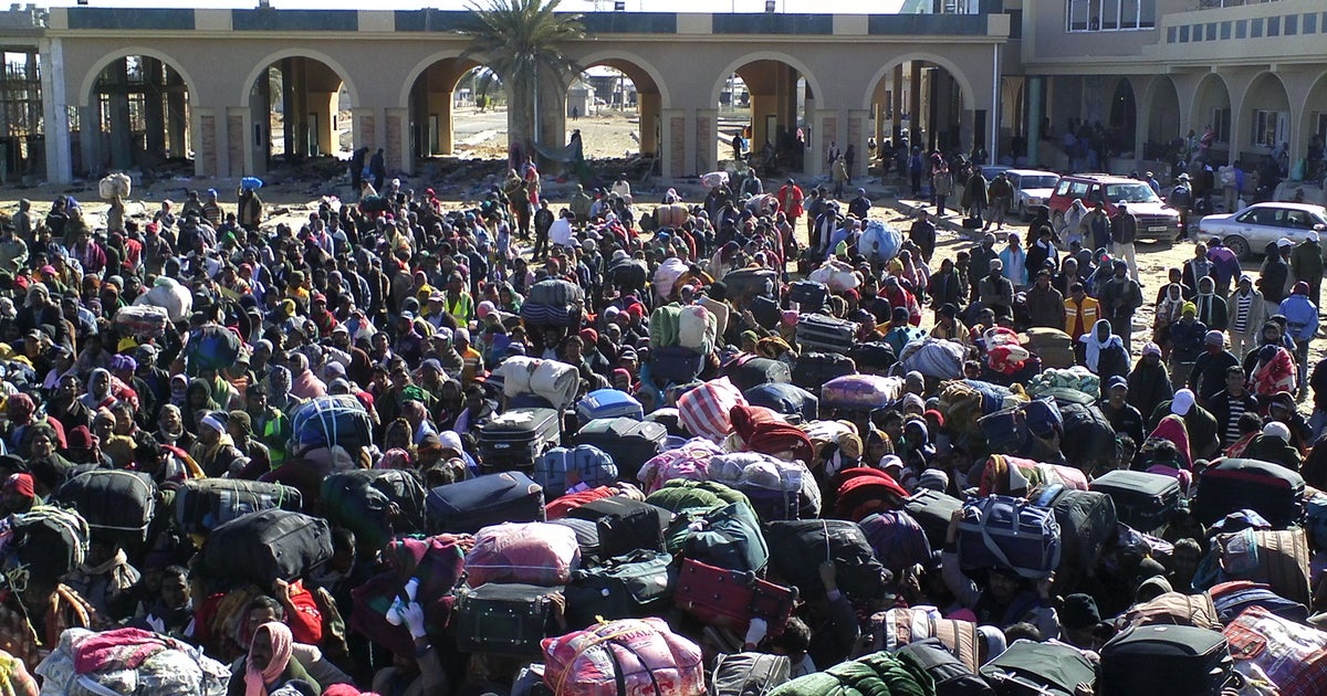 Humanitarian crisis as 180K flee Libya violence - CBS News