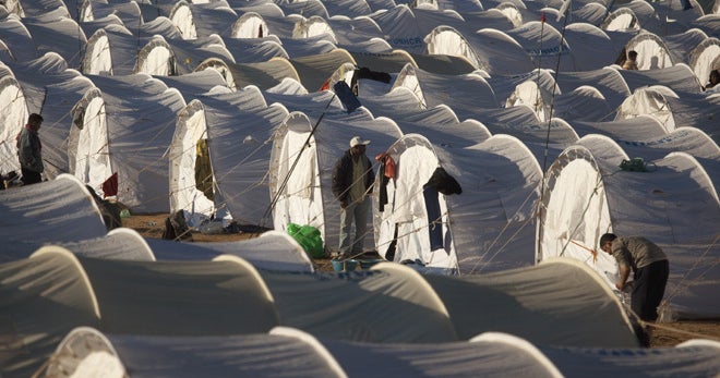 Camp for displaced grows near Libyan border - CBS News