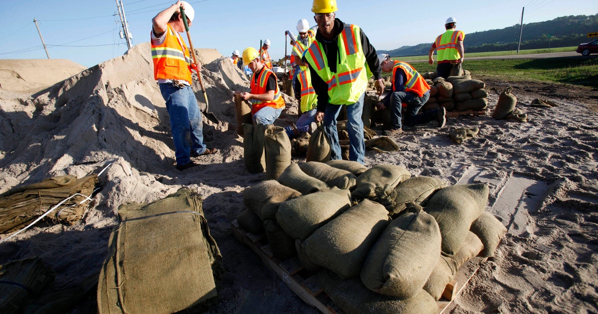In fight against floodwater, sand running out - CBS News