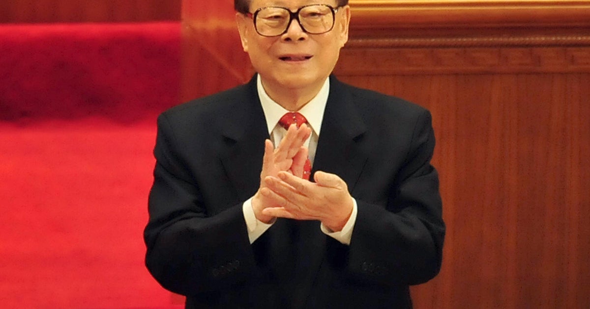 China's ex-president misses party, but is he dead? - CBS News