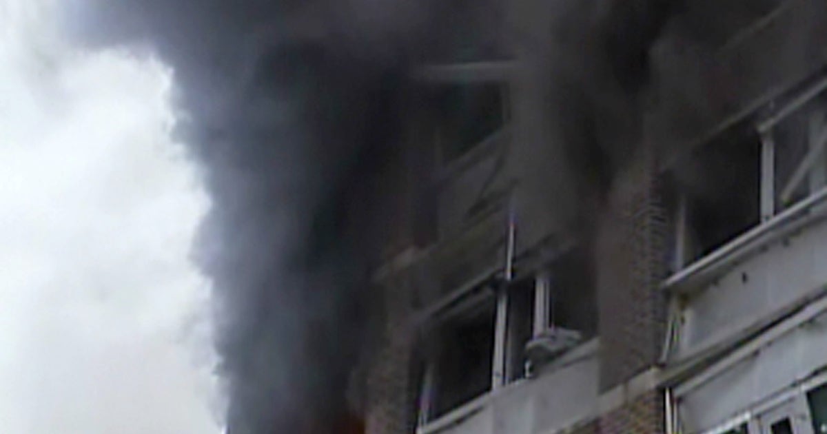 Oslo building billows smoke, people trapped - CBS News