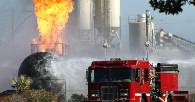 Burning rail car explosion threat passes - CBS News