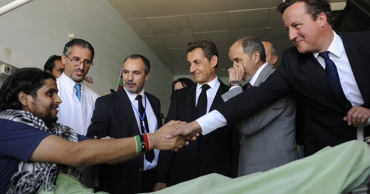 U.K., French leaders visit Libya, bring cash - CBS News