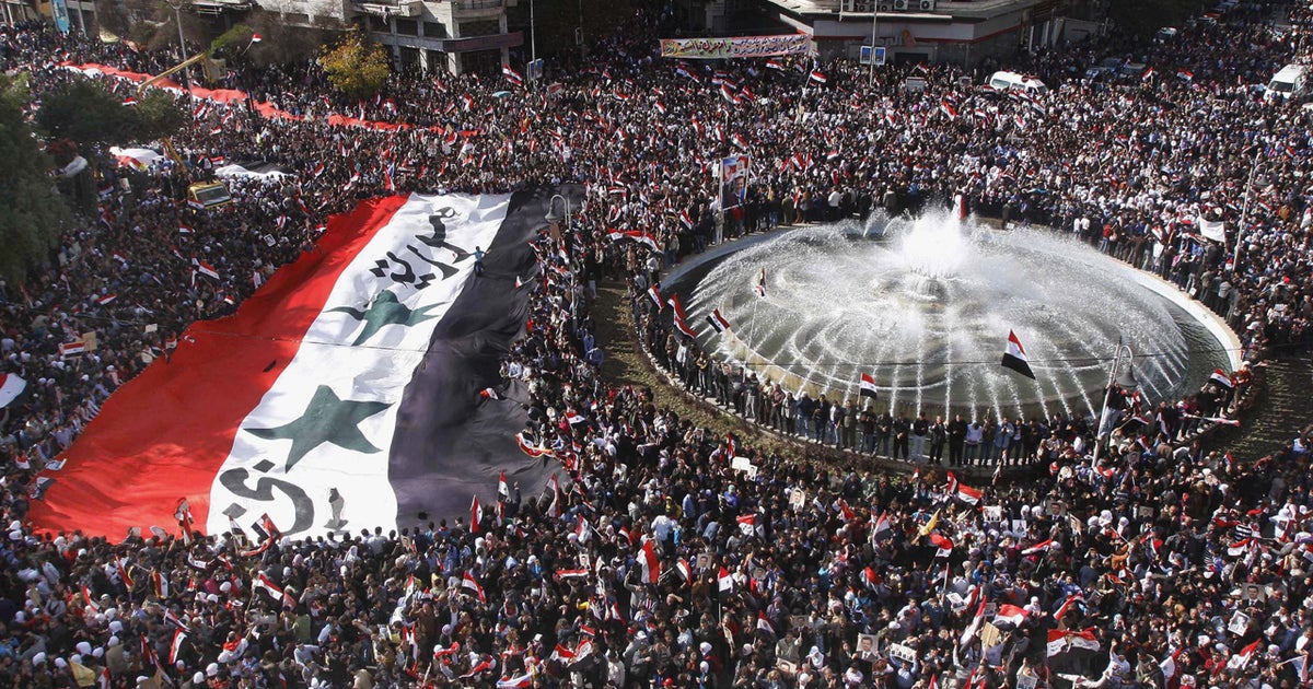 Syrians march in support of Assad - CBS News