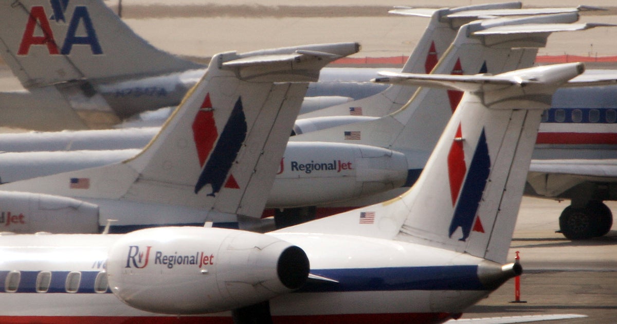 Plane slides off runway in another O'Hare mishap - CBS News
