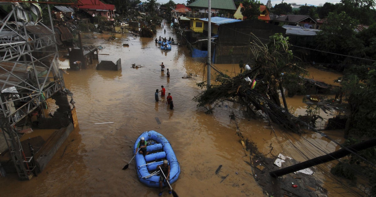 Flash floods kill at least 450 in Philippines - CBS News