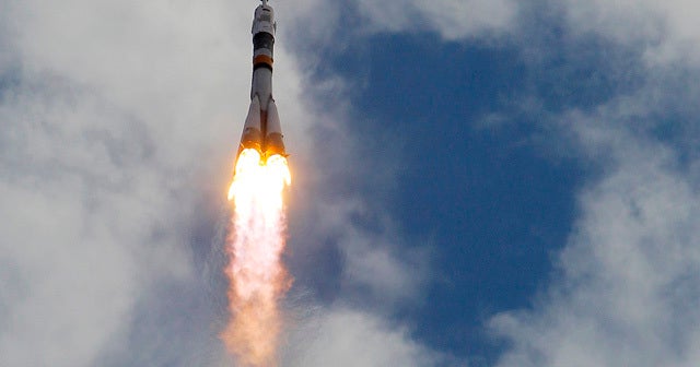 Soyuz rocket launches on mission to space station - CBS News