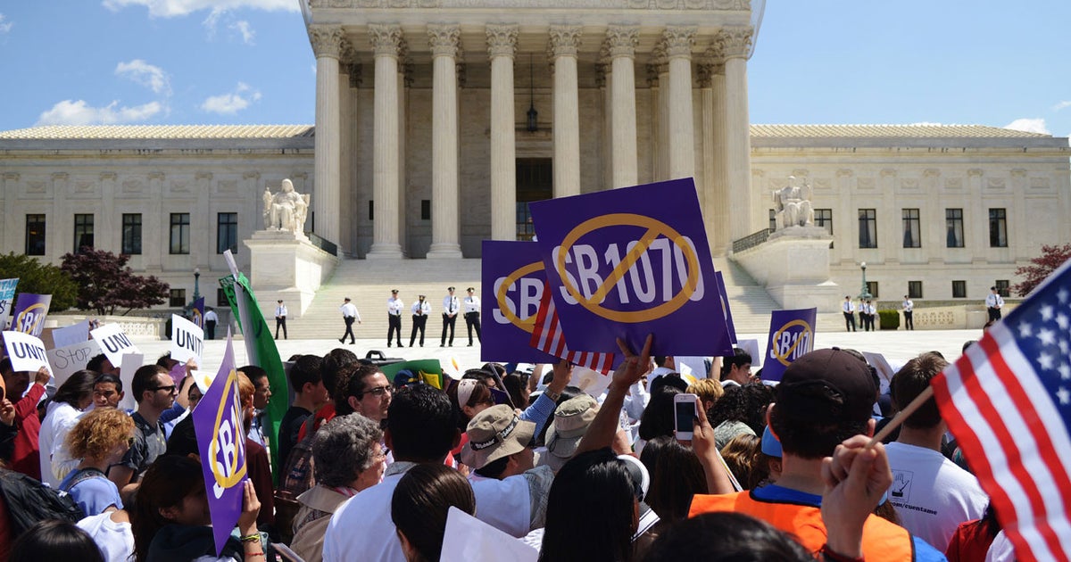 Judge allows Arizona police to check immigration status of suspected ...