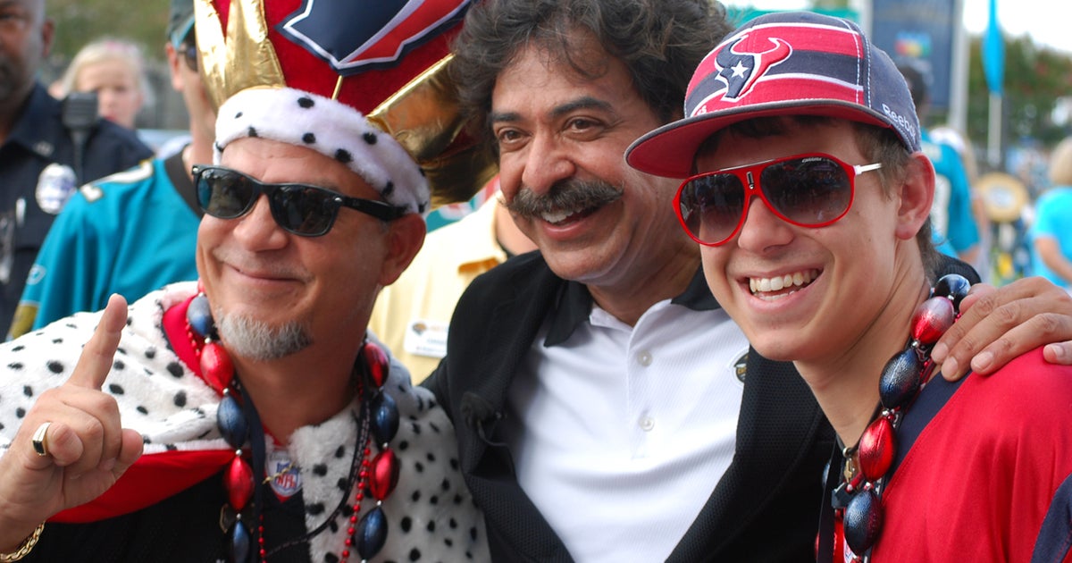 Behind Khan's signature mustache - CBS News