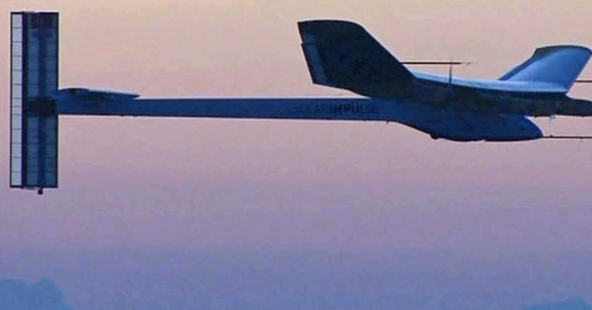 First of its kind solar plane flies at night - CBS News