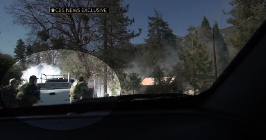 Gun battle with wanted ex-cop - caught on tape - CBS News