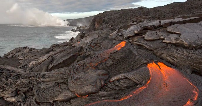 Time-lapse view of volcanoes (and surfing bonus) - CBS News