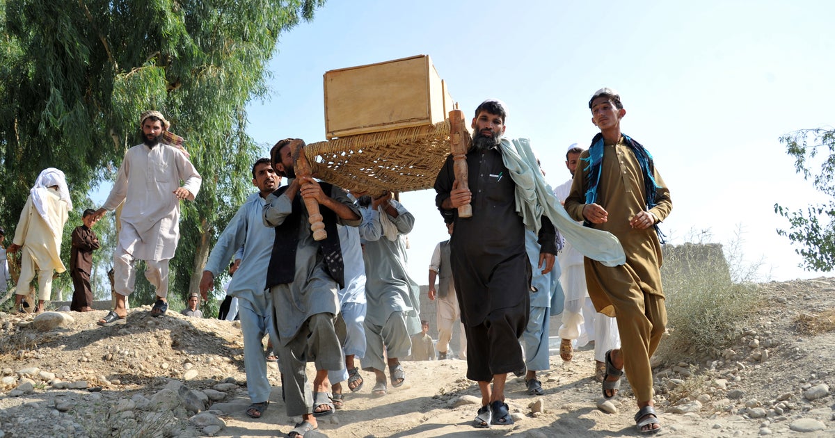 Afghanistan graveyard bomb blast kills 14 women and children - CBS News