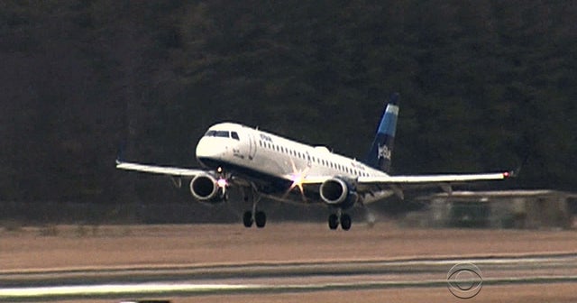 JetBlue flight makes emergency landing after slide deploys - CBS News
