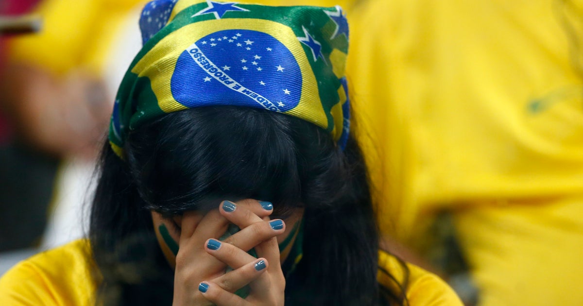 Faces of agony and ecstasy of German, Brazil fans