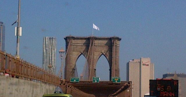 Mysterious white flags appear atop Brooklyn Bridge - CBS News