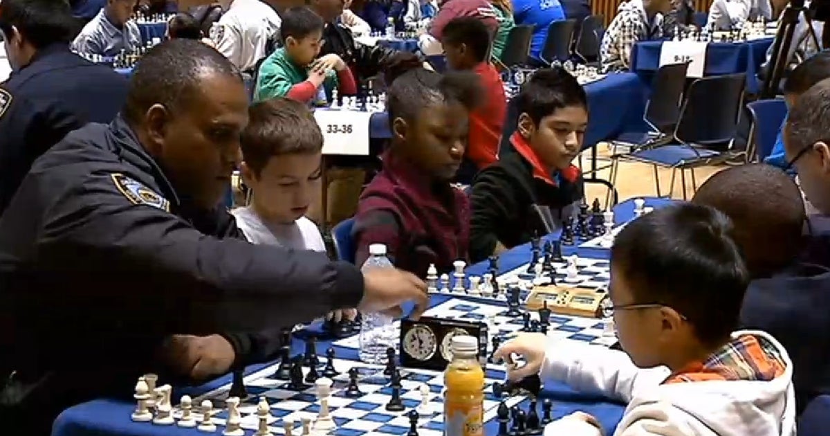 NYPD officers face off against inner-city kids on chessboard - CBS News