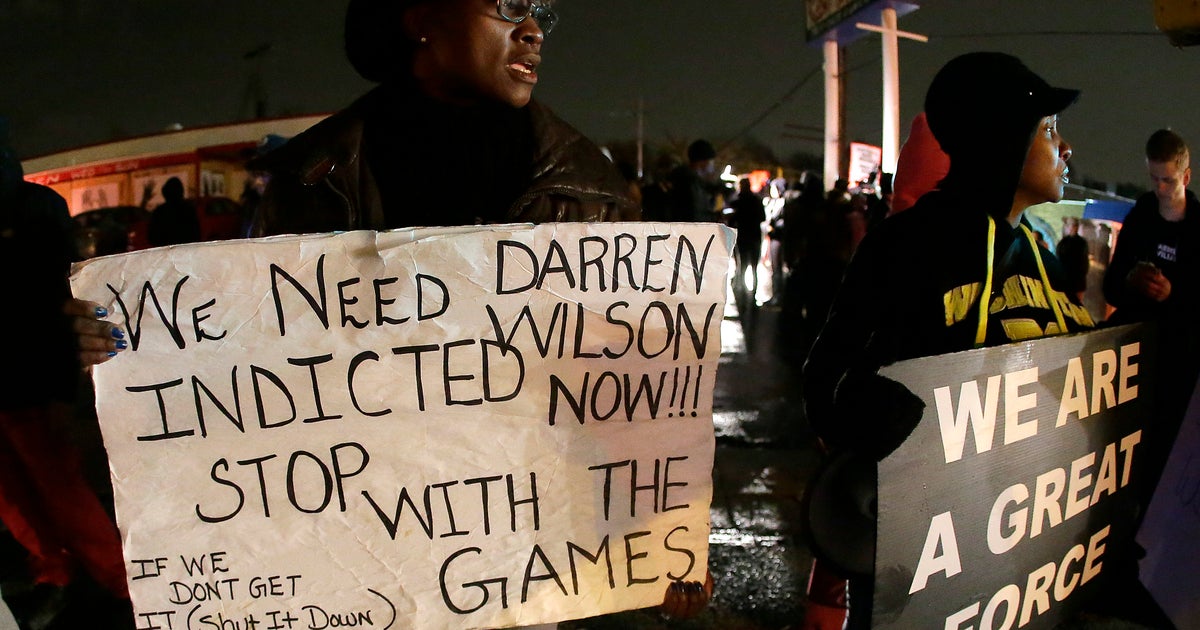 Protests continue as Ferguson area awaits grand jury decision - CBS News