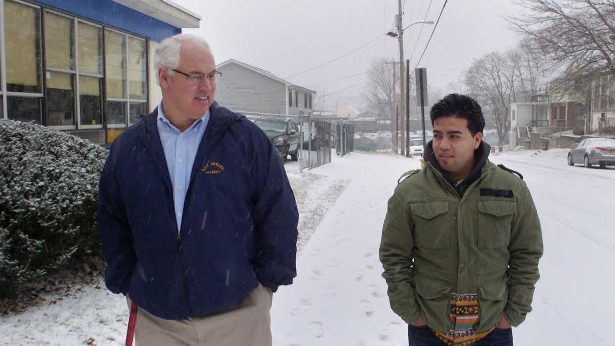 On crime-ridden streets, a priest and his school offer a way out - CBS News
