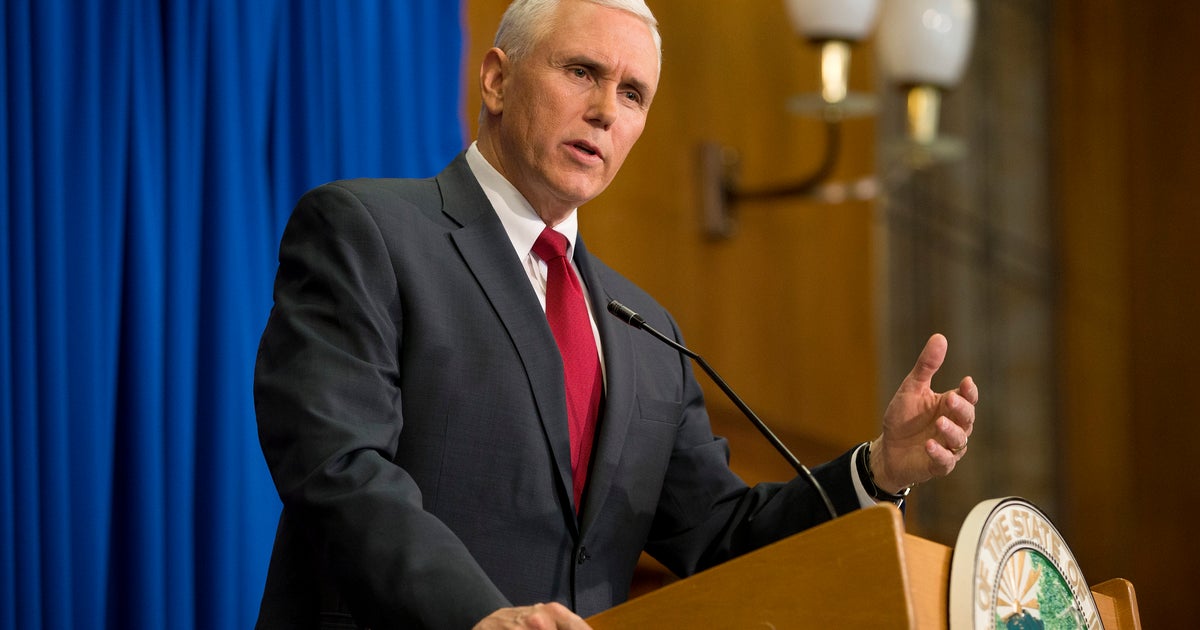 Indiana governor signs updated religious freedom law - CBS News