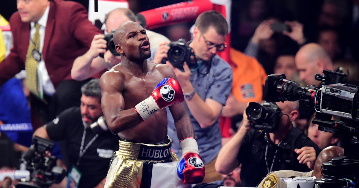 Mayweather vs. Pacquiao: Holding $100 million check, Mayweather talks ...