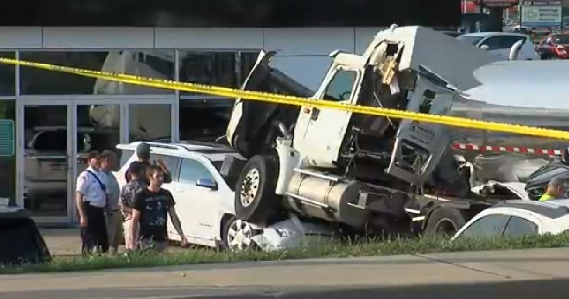 Trucker choking on soft drink crashes into 23 new cars, police say ...