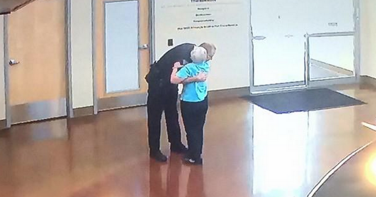 Elderly woman walks into police station, asks for hug - CBS News