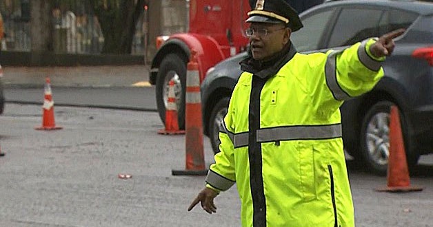 Boston police Capt. Haseeb Hosein and patrol officer David Godin help ...
