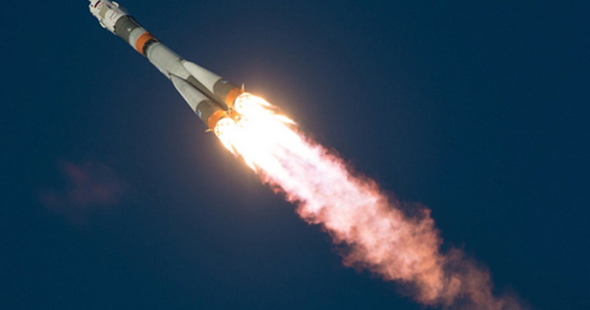 Soyuz crew overcomes glitch to dock with space station - CBS News