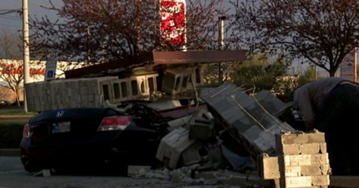 Chipotle sign crushes car that had driver in it - CBS News
