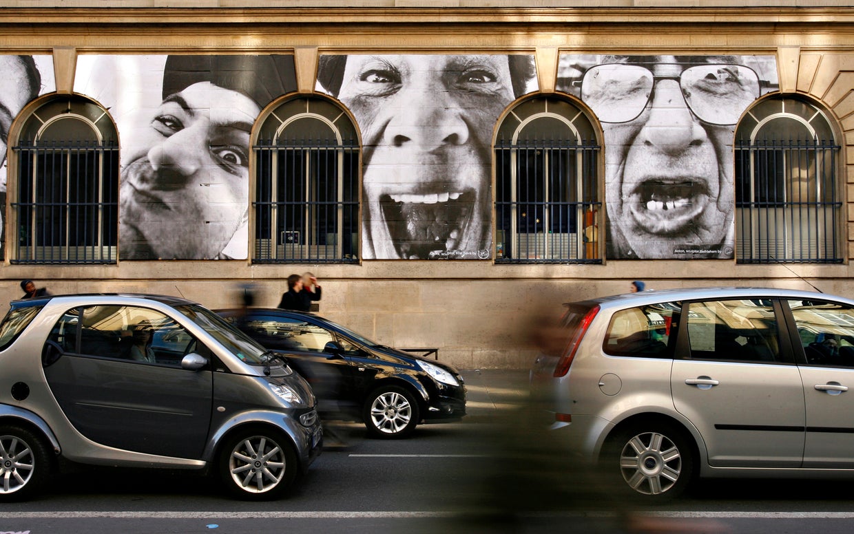 French street artist JR makes the Louvre Pyramid disappear