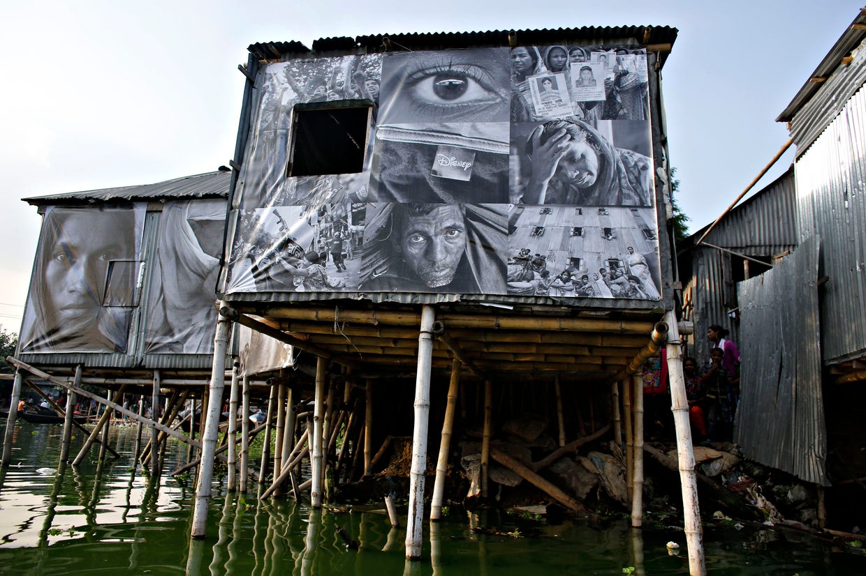 French street artist JR makes the Louvre Pyramid disappear