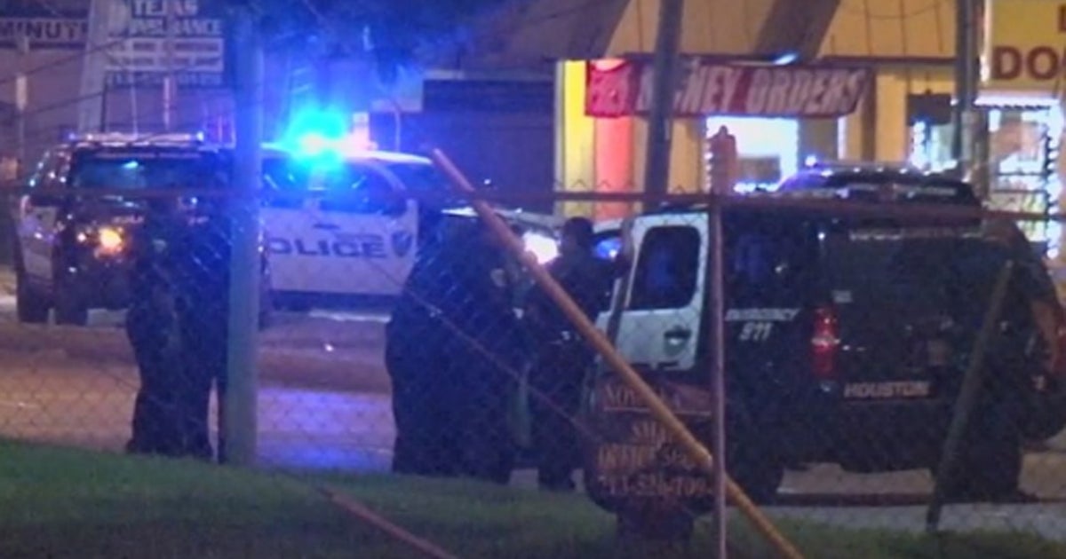 Houston motel standoff: Dozens of shots fired at officers - CBS News