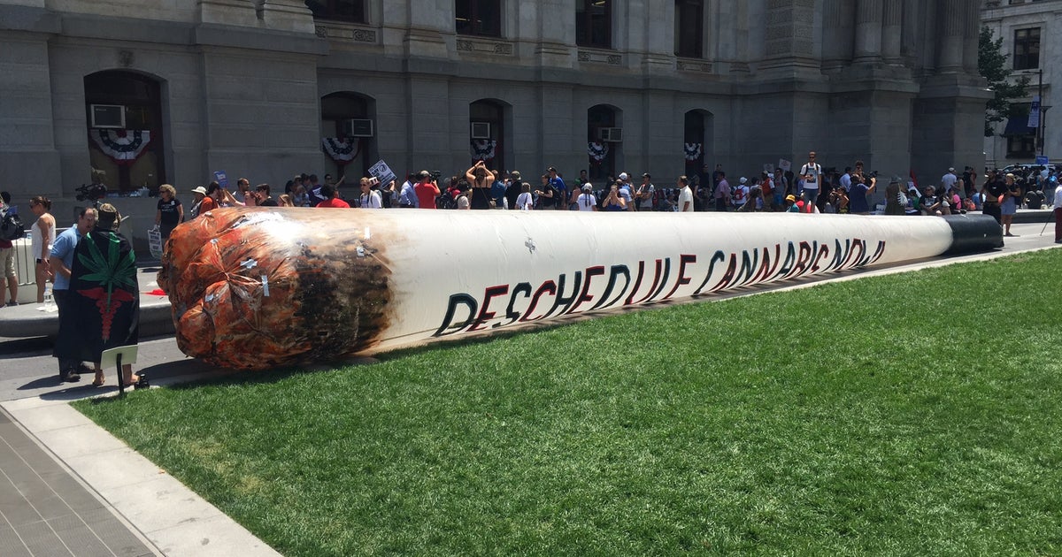 Marijuana activists march with 51-foot joint during DNC - CBS News