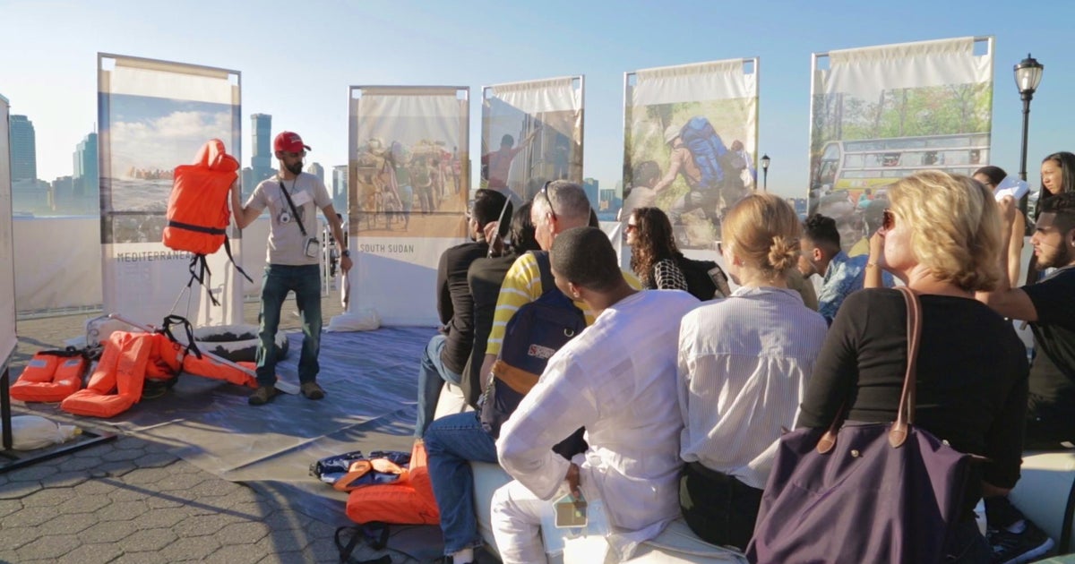 Refugee exhibit shows what it’s like to be forced from home - CBS News