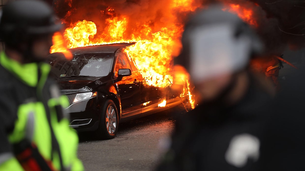 Trump inauguration protest damages parts of downtown Washington - CBS News