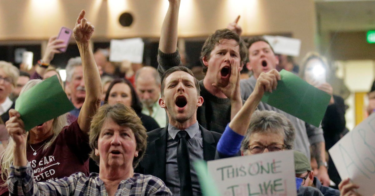 Meet the protesters flooding politicians' town halls - CBS News