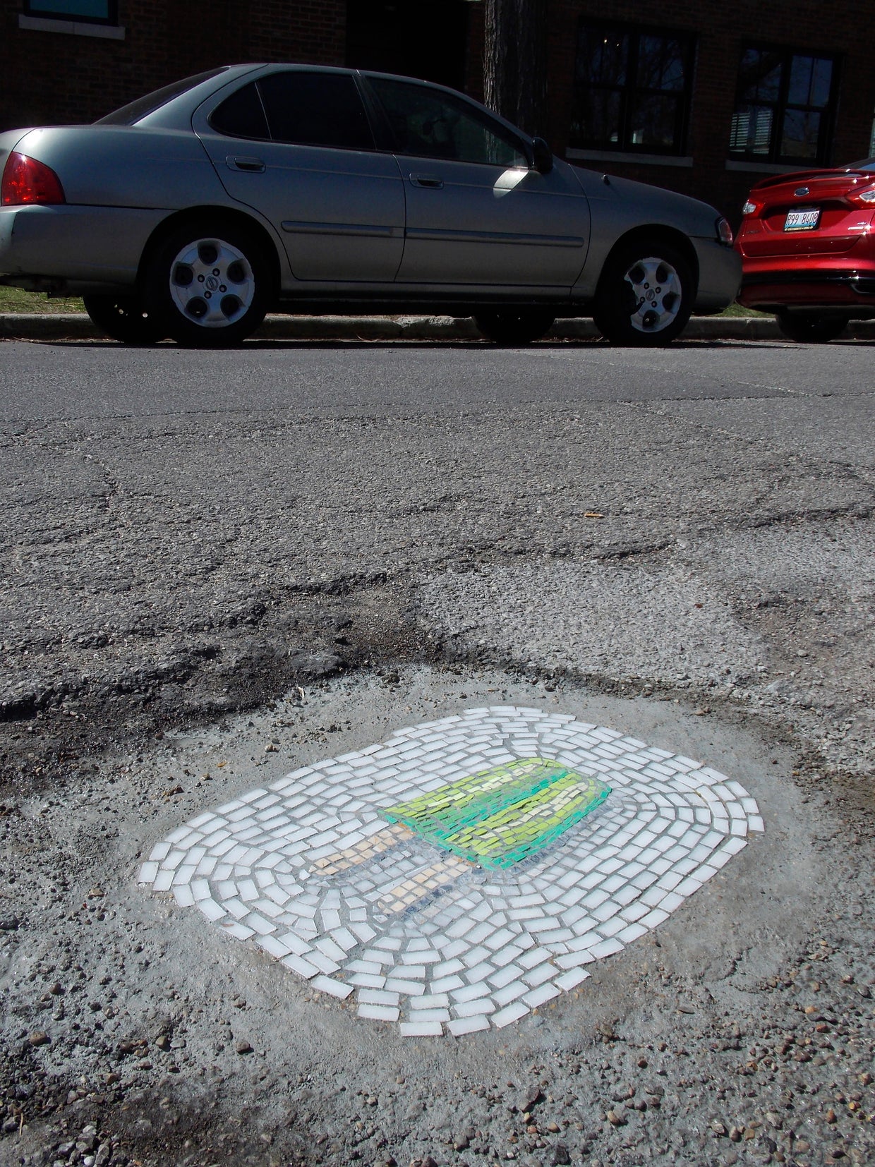 Street art: Jim Bachor's pothole mosaics