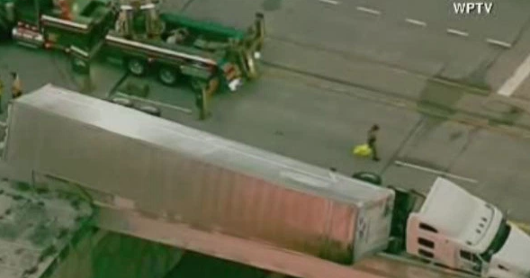 Tow truck driver falls to his death while trying to upright big rig ...