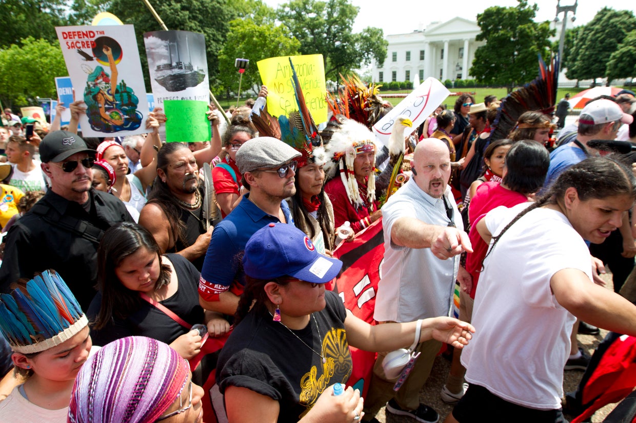 Climate march: Protesters demand action on climate change to mark Trump ...