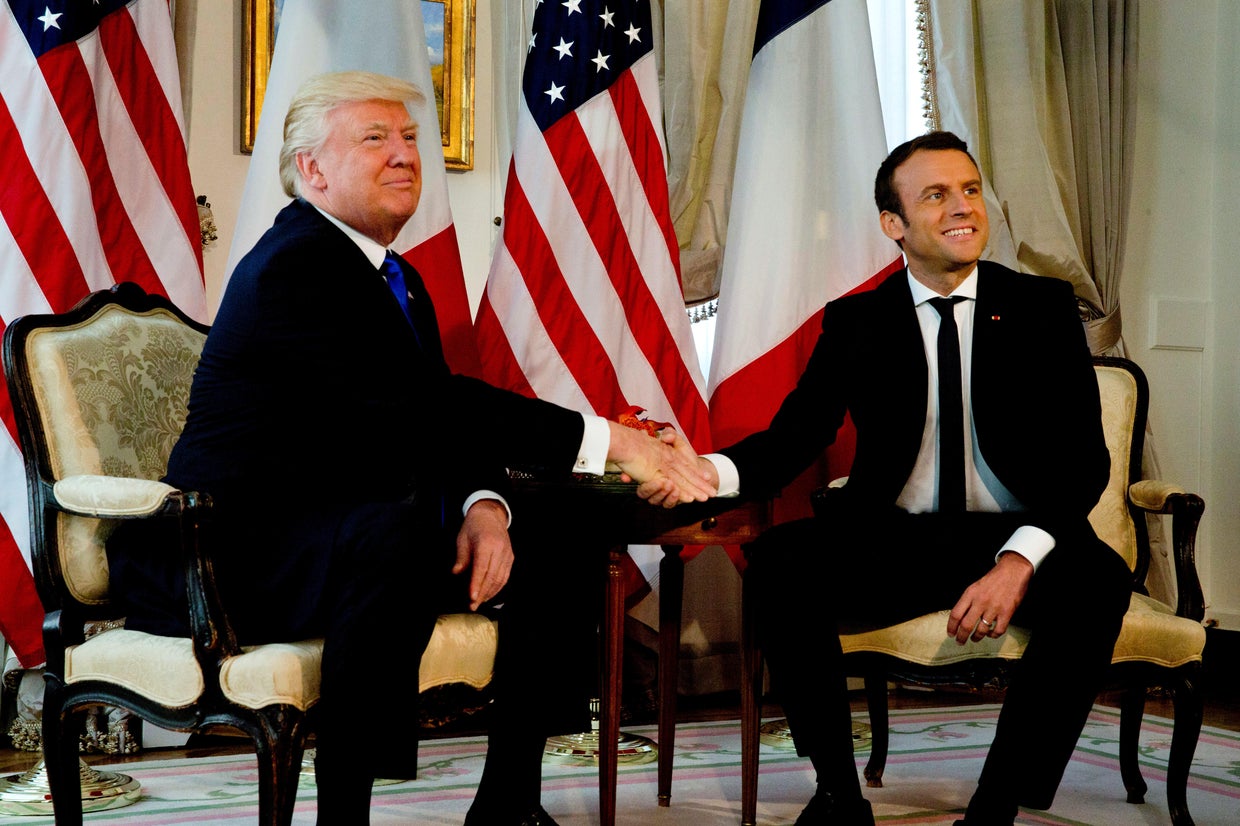 Trump, Macron handshake turns into showdown - CBS News