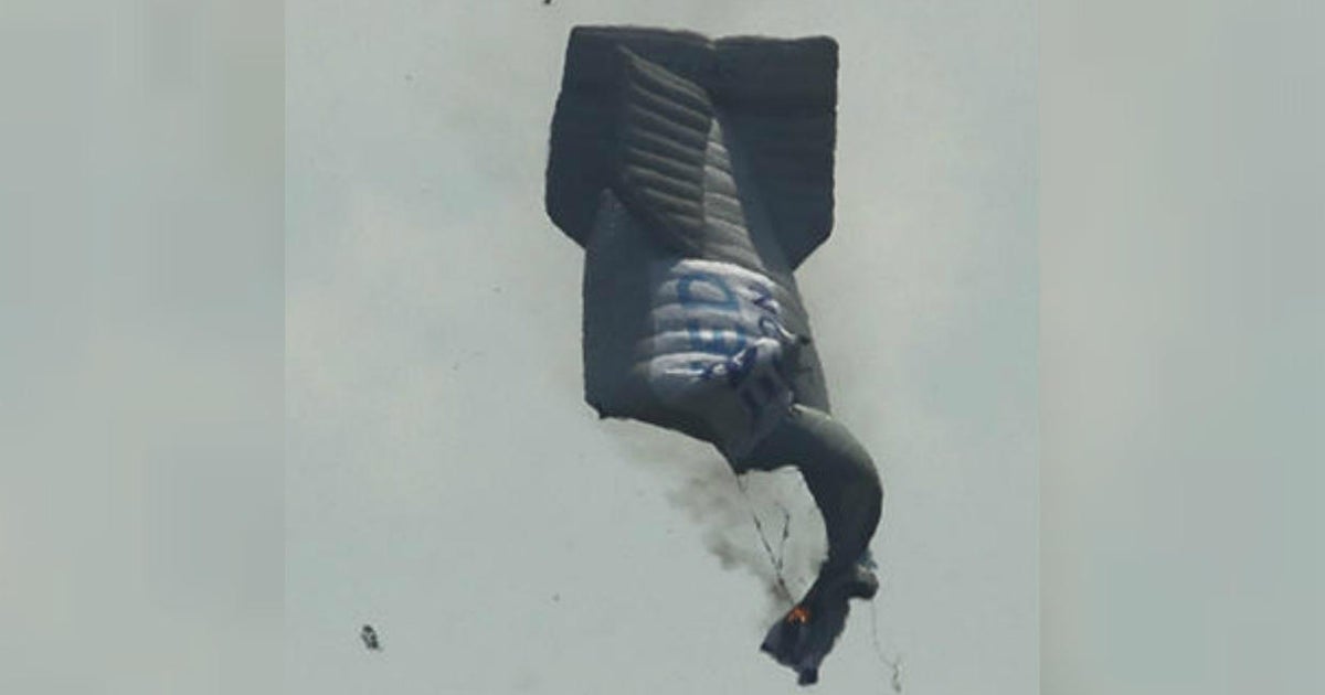 Blimp crashes near U.S. Open after catching fire - CBS News
