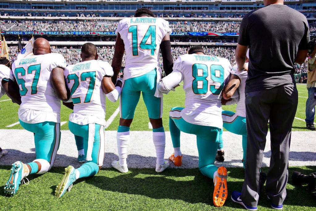 NFL players kneel, raise fists, lock arms during national anthem - CBS News