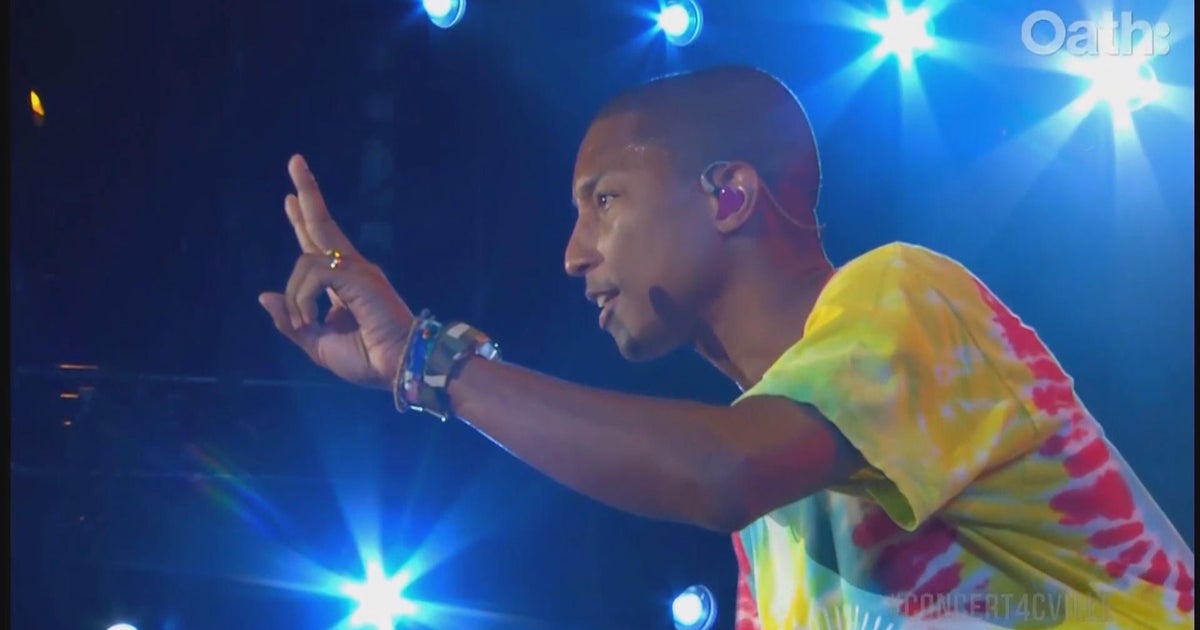 Pharrell Williams, others take knee at Charlottesville concert - CBS News