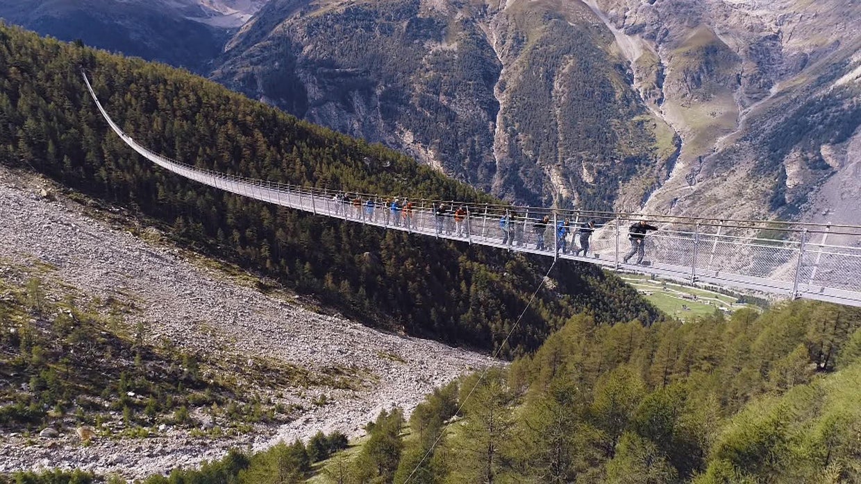 World's longest suspension footbridge thrills hikers in the Swiss Alps ...