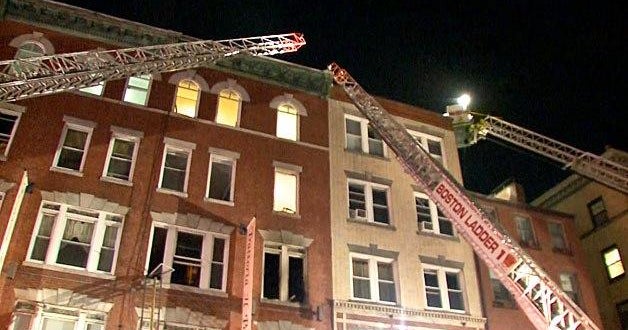 Man dies leaping from fatal fire in Boston - CBS News