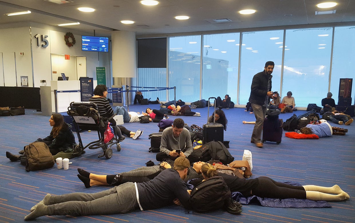 "Cascading failures" strand thousands at flooded, frigid JFK - CBS News