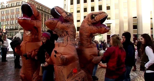 Dozens dress as Tyrannosaurus rex in Maine - CBS News